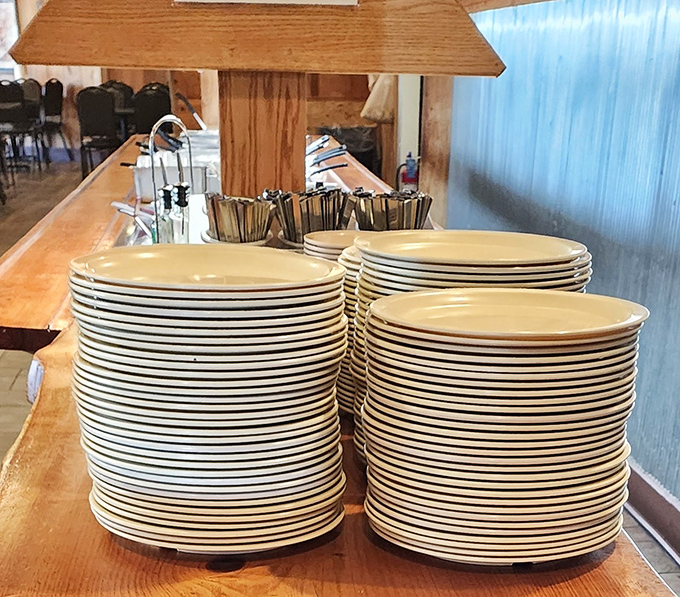 Stacks of plates waiting for their moment of glory &ndash; soon to be the canvas for Cajun masterpieces.
