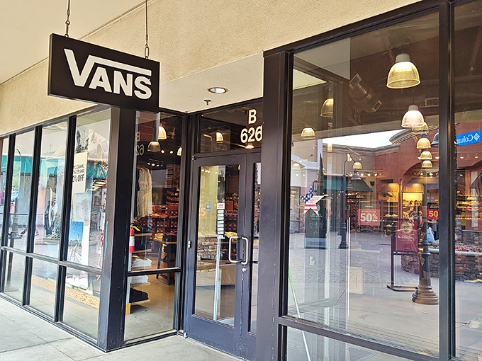 Vans' iconic logo promises California cool at outlet prices, where skate culture meets desert heat in a perfect storm of style savings.