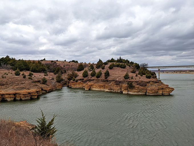 Dramatic sandstone cliffs plunge into calm waters, creating the kind of view that makes smartphone cameras feel wholly inadequate.