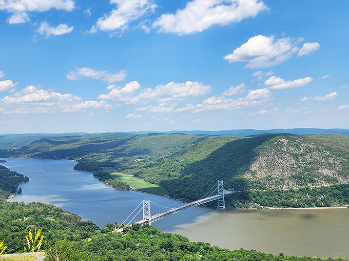 A view that makes you question city living. The Hudson River and Bear Mountain Bridge create a panorama worth every step of the climb.