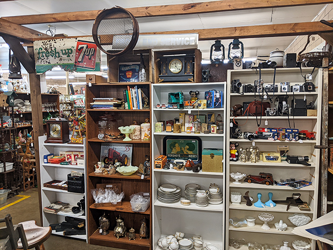 Vintage treasures arranged with care – where oil lamps, cameras, and childhood toys create a timeline of American domestic life.