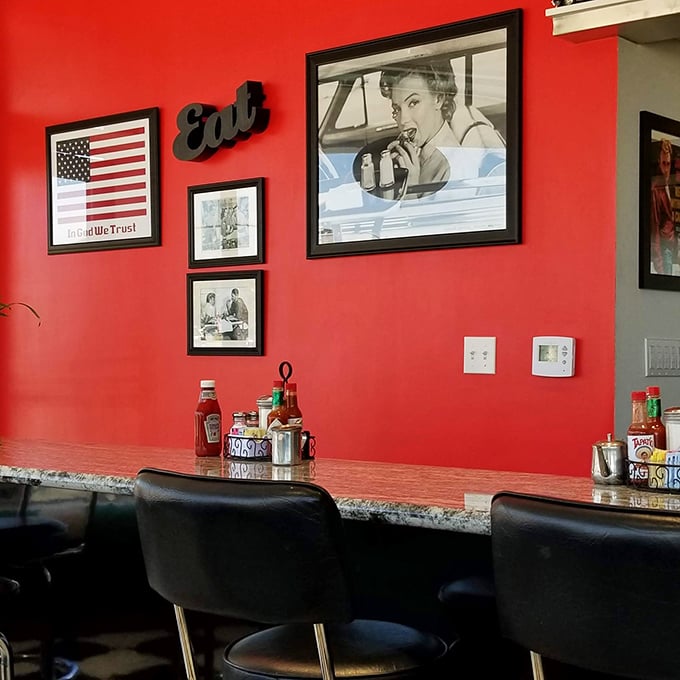 Red walls adorned with vintage photography create the perfect backdrop for meals that taste like childhood memories, even if they're not yours.