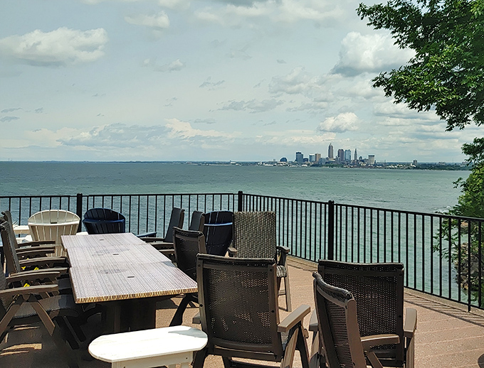 Lake Erie stretches toward Cleveland's skyline, reminding diners that sometimes the best views come with the best meals. Urban panorama meets waterfront serenity.