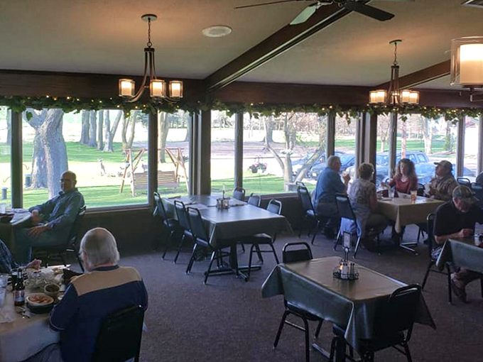 The sunlit dining area offers views of small-town Wisconsin life passing by, while inside, timeless traditions of good eating continue uninterrupted.