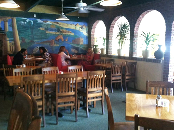 Natural light floods through windows, illuminating a dining room where conversations flow as freely as the mint tea.