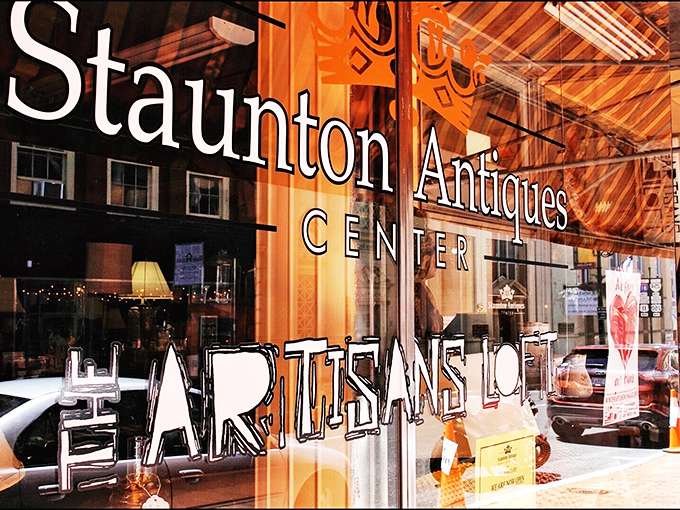 The window announces "Staunton Antiques Center" with the confidence of someone who knows they've got what you're looking for.