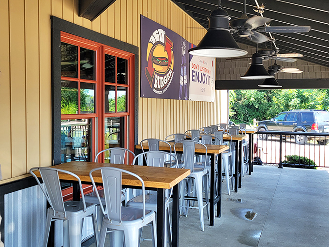 360 Burger's outdoor seating area invites you to linger over lunch. Those metal chairs may look industrial, but they've cradled countless happy diners.