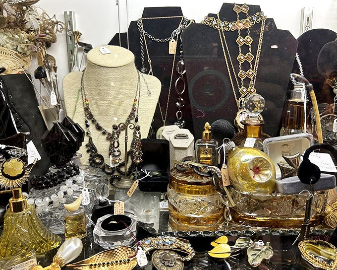 A treasure chest of vintage glamour&mdash;where perfume bottles and costume jewelry create a still life worthy of a Jazz Age socialite's dressing table.