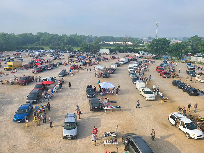 The grand spectacle from above&mdash;a community united by the thrill of the hunt. Cars, canopies, and conversations create this uniquely American weekend ritual.