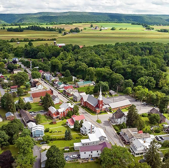 From above, Millheim reveals its perfect positioning &ndash; nestled between rolling hills and farmland that stretches toward forever.