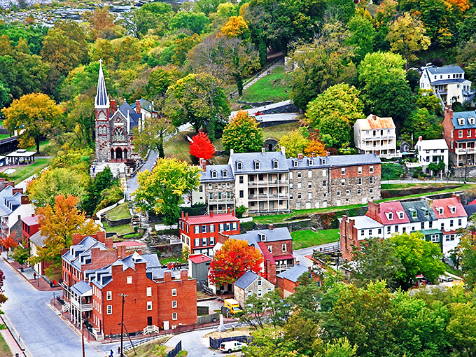 This aerial view reveals Harpers Ferry's perfect choreography of nature and history, where autumn trees perform their annual color spectacular.