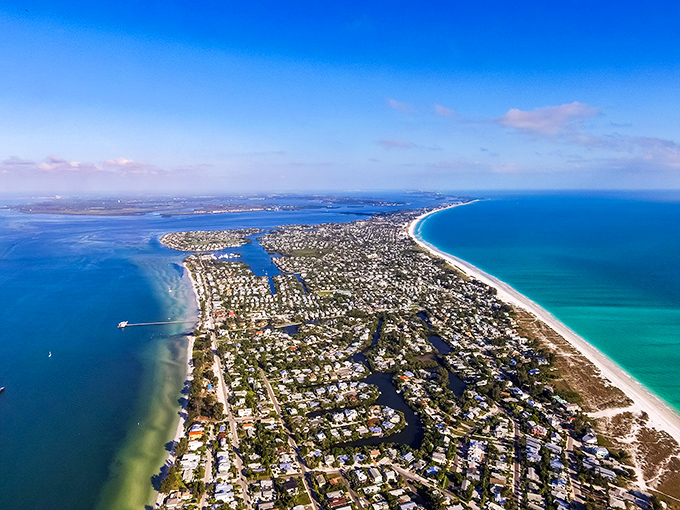 Anna Maria Island from the sky reveals its perfect positioning &ndash; nestled between Gulf and bay waters like Florida's best-kept secret hiding in plain sight.