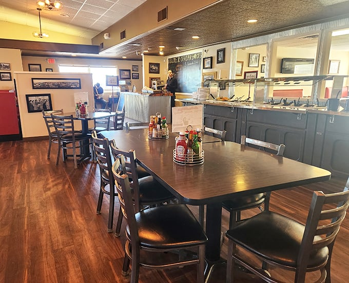 Wooden tables waiting for hungry diners, with the buffet line standing ready in the background. This isn't just a restaurant&mdash;it's a morning ritual in physical form.