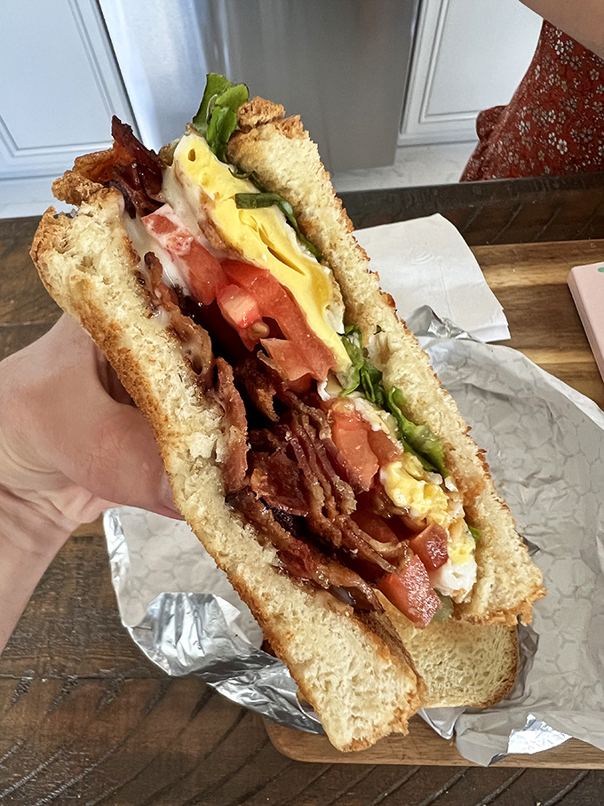 This BLT towers with crispy bacon, fresh vegetables, and egg, transforming a classic into something truly extraordinary.