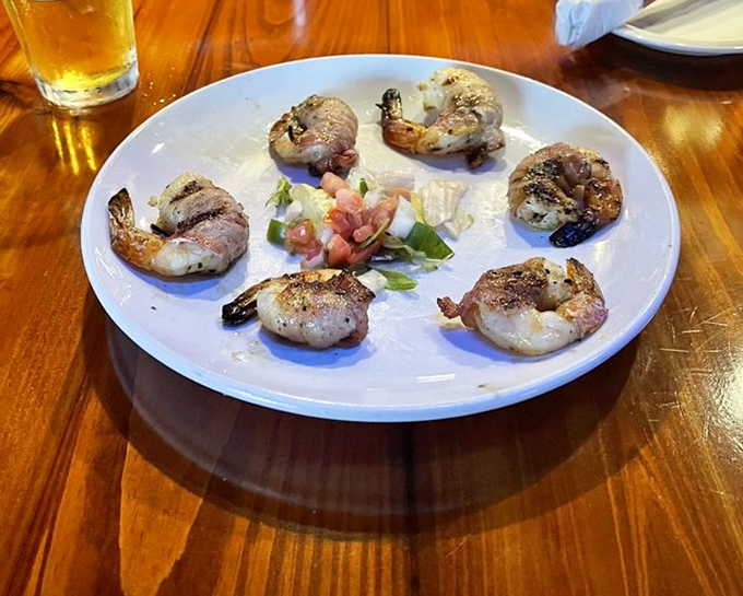 These bacon-wrapped shrimp aren't just appetizers&mdash;they're little ambassadors of land-meets-sea perfection that disappear faster than Kansas rain.