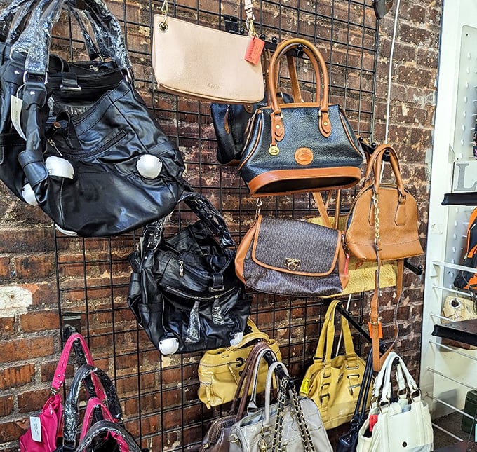 Handbag heaven on a brick wall. That cognac leather tote has "reliable companion for weekend antiquing" written all over it.