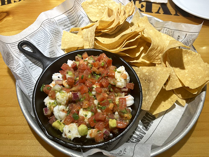 Baja Ceviche in a cast iron skillet&mdash;where fresh shrimp takes a citrus bath before joining the fiesta with tortilla chips.