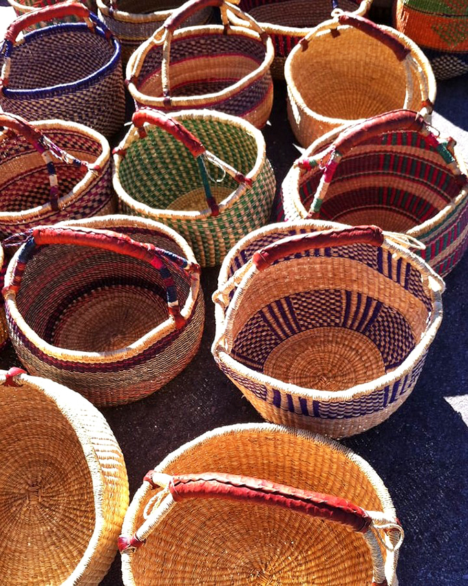 Hand-woven baskets catching California sunshine, each one a portable masterpiece ready to organize your beautiful chaos at home.
