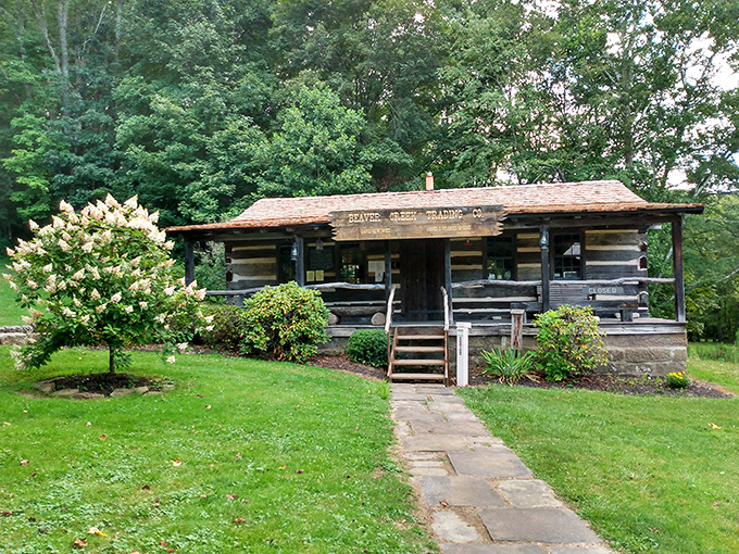 The Beaver Creek Trading Co. welcomes visitors with rustic charm and flowering shrubs. A slice of pioneer life preserved in the Ohio wilderness.