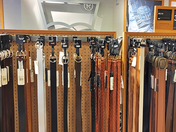 The belt display at Levi's offers the finishing touch to your outlet haul, proving accessories are the unsung heroes of discount fashion.