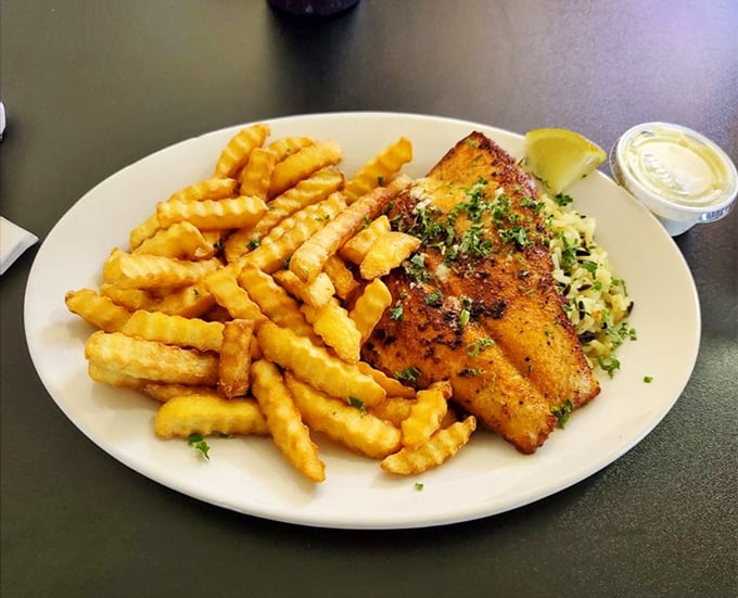 Blackened mahi mahi with waffle fries proves that sometimes the simplest preparations let great fish shine brightest.