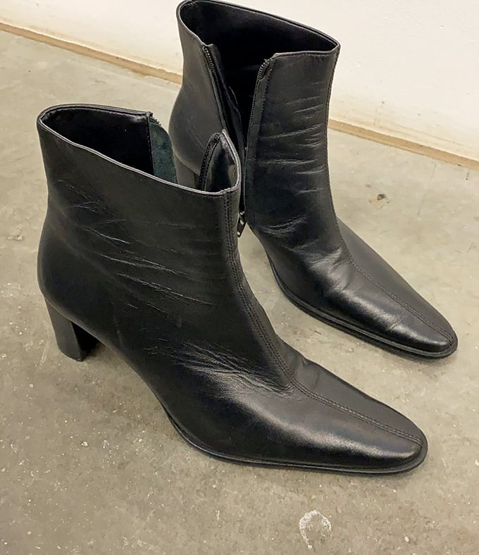 These sleek leather boots have stories to tell and miles yet to walk. Someone's fashion loss becomes your wardrobe win.
