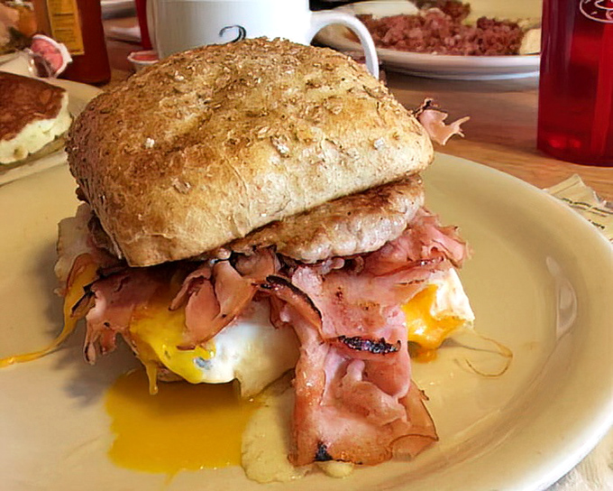 Breakfast sandwich architecture at its finest. The runny egg yolk creates nature's most perfect sauce for that mountain of ham.