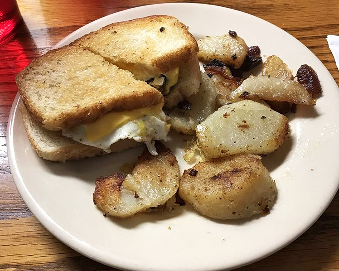 The breakfast sandwich and home fries combo&mdash;proof that sometimes the simplest morning pleasures are worth getting out of bed for.