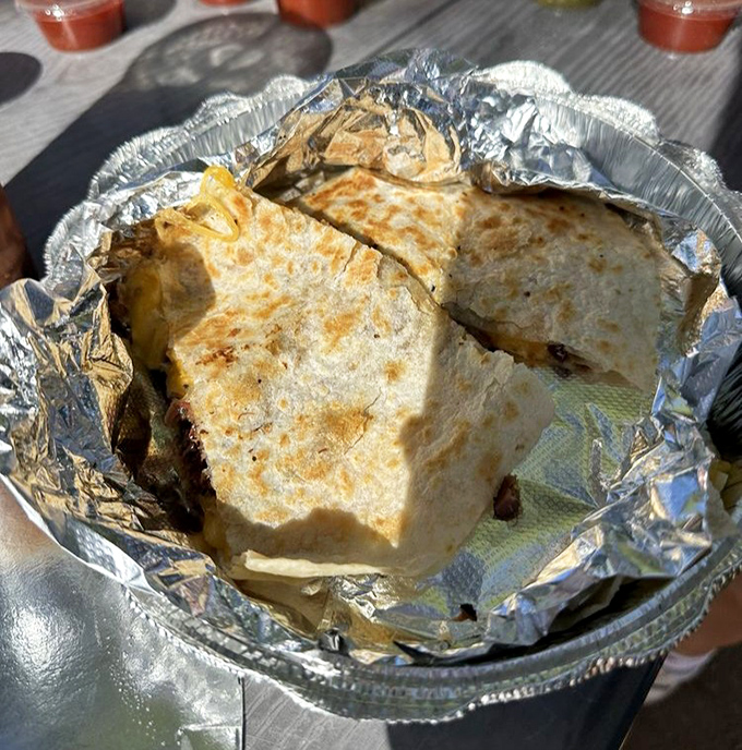Foil-wrapped quesadilla looking like a delicious present you give yourself for being awesome today.