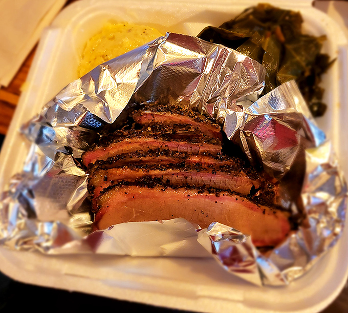 Brisket slices with that telltale pink smoke ring &ndash; evidence of the low-and-slow cooking that separates the great from the merely good. 