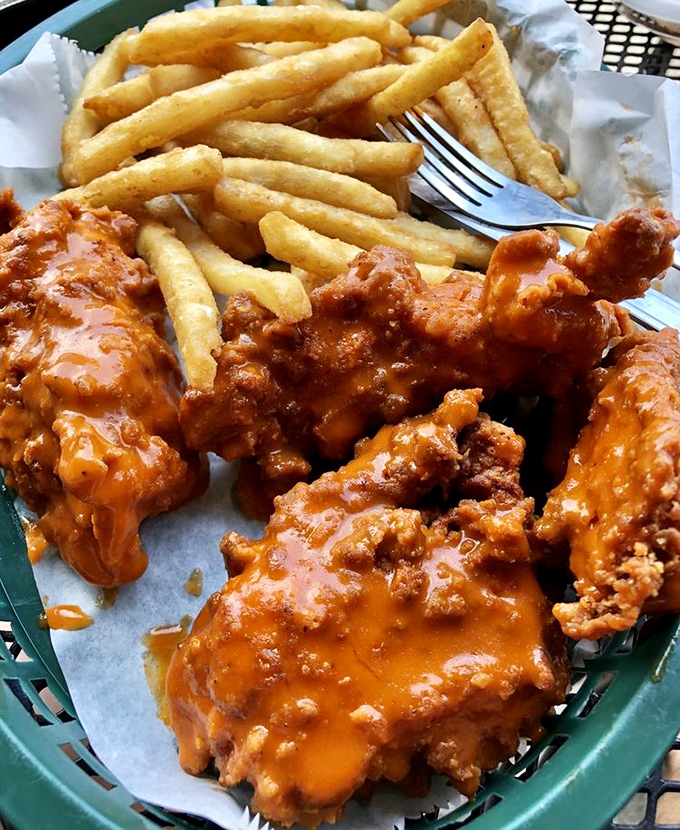 Buffalo wings glistening with sauce and crispy fries&mdash;because sometimes you need wings before you can truly soar into happiness.