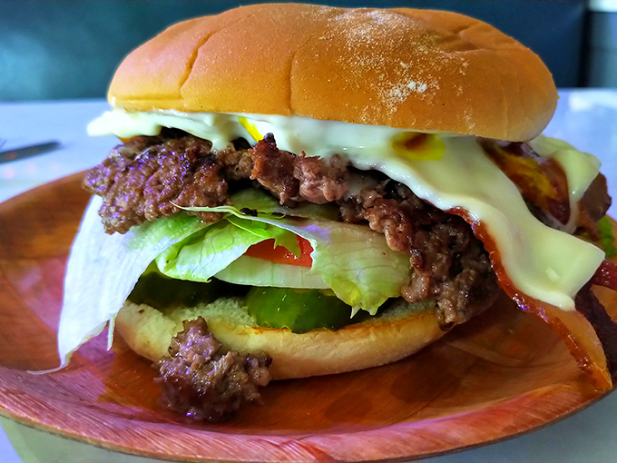 This isn't just a burger; it's an architectural achievement of beef, cheese, and fresh toppings.