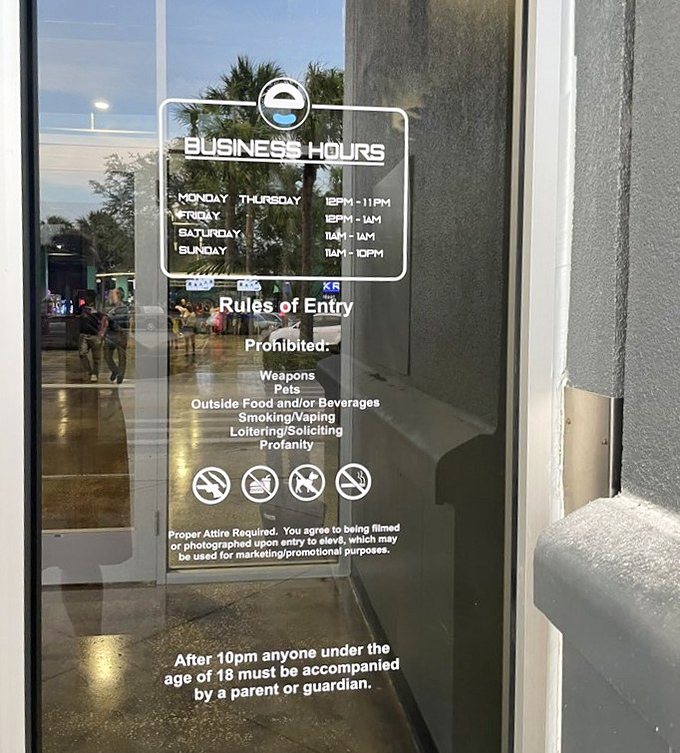 Business hours posted clearly on the entrance&mdash;because even in a world of fun, someone has to be the responsible adult who tells you when it's time to go home.