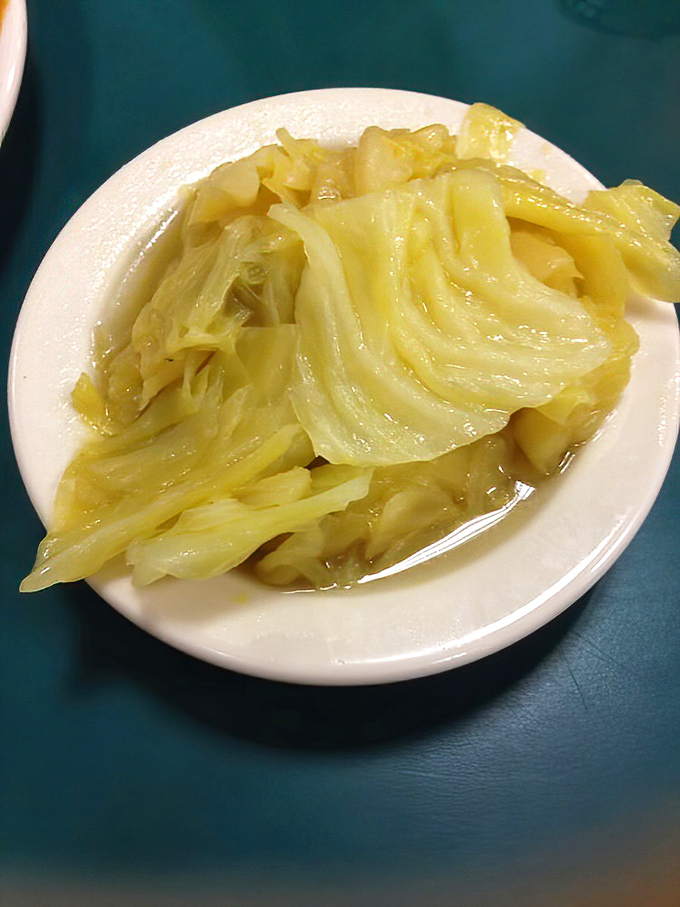 Cabbage cooked to translucent perfection – the vegetable equivalent of a slow dance, tender and somehow both humble and elegant at once.