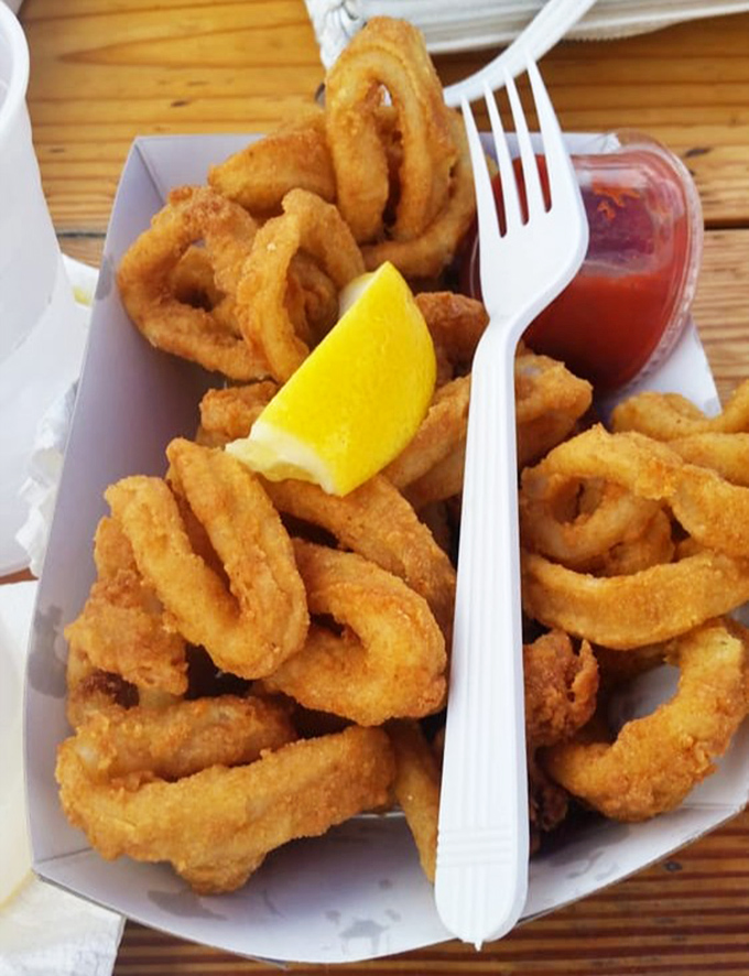 Rings of golden delight. These perfectly fried calamari with their crisp exterior and tender interior might just disappear before you can say "seafood."