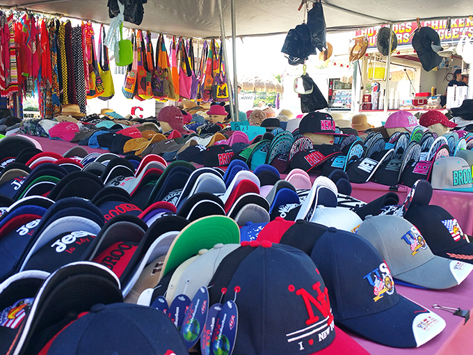 A sea of caps and hats in every imaginable color creates a textile rainbow, proving that protecting yourself from the sun can be stylish.