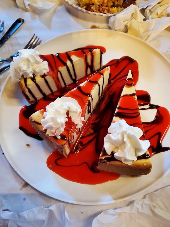 Cheesecake drizzled with raspberry sauce&mdash;because after battling crab legs and peeling shrimp, you've earned this sweet finale.