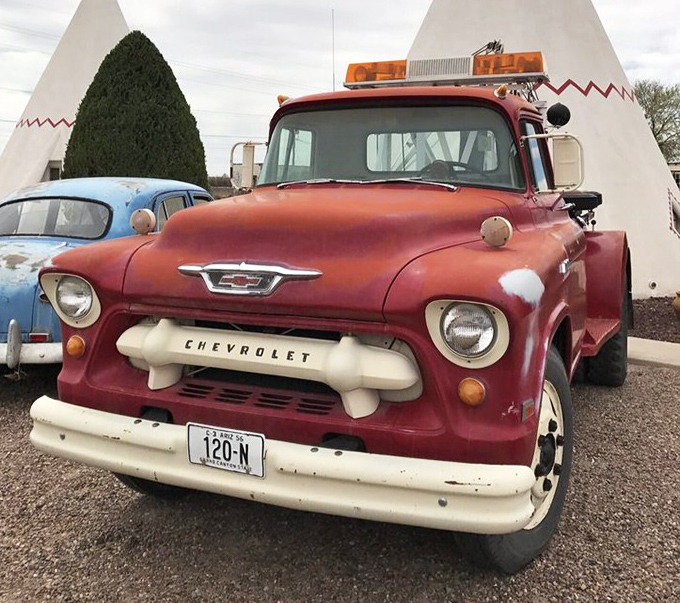 This cherry-red Chevy truck stands guard outside the teepees, a Detroit sentinel watching over this slice of Americana.