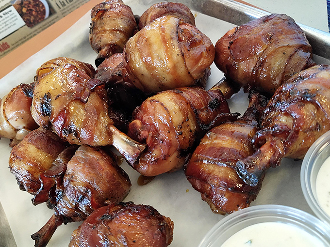 Chicken lollipops: where meat meets whimsy. Bacon-wrapped drumsticks transformed into handheld flavor bombs that would make Fred Flintstone jealous.