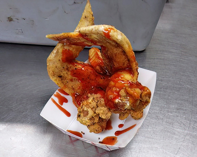 Wings with sauce applied with the precision of a painter finishing a masterpiece. Finger-licking evidence that simplicity often tastes best.