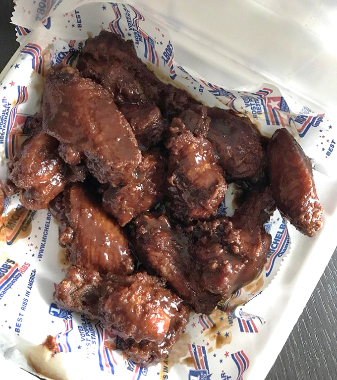 These wings aren't playing around. Slathered in sauce and ready to challenge your napkin supply and willpower simultaneously.