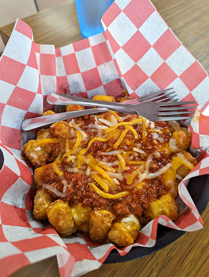 Chili cheese tots that make you question why you've wasted time eating potatoes any other way. A beautiful mess that's worth every napkin you'll need.