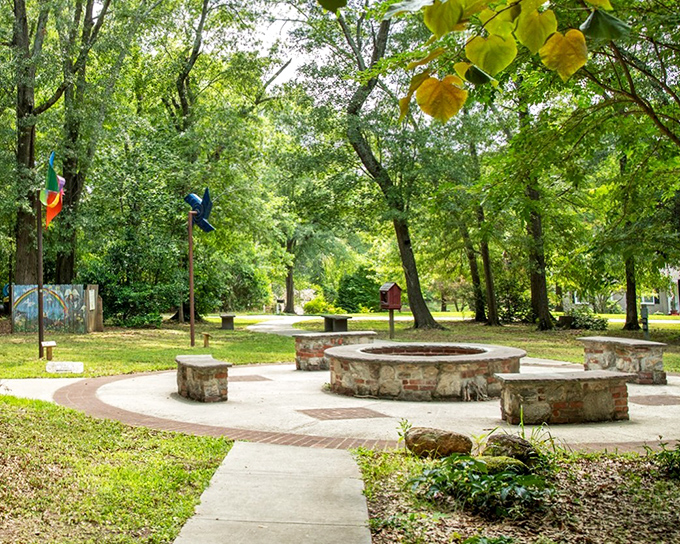 Chimney Park's stone fire pit circle invites community gatherings where stories are shared and memories made under Georgia's generous tree canopy.