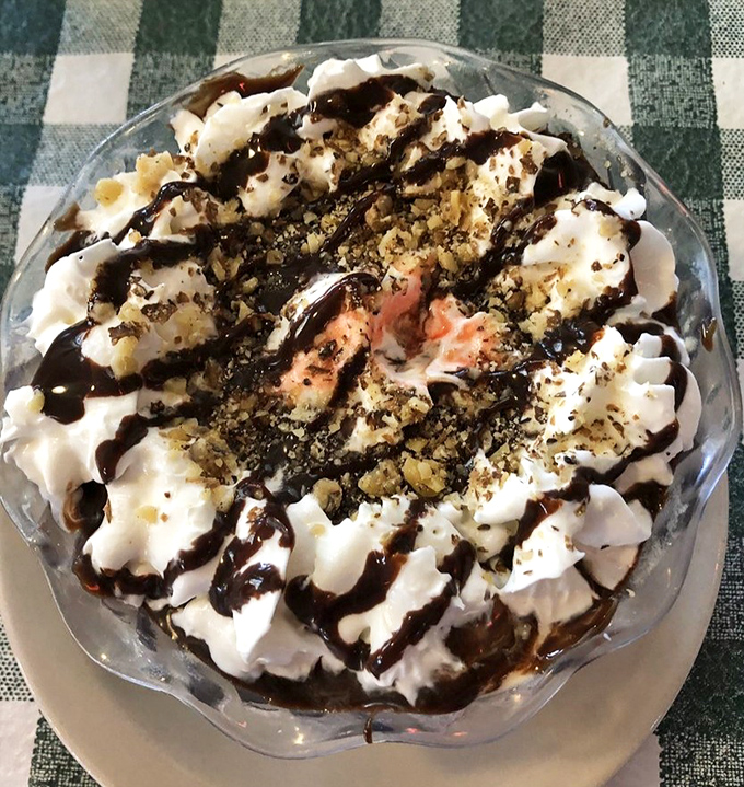 Dessert that demands a moment of silence. Whipped cream, chocolate drizzle, and crumbled toppings create a sweet finale that's worth every calorie-laden spoonful.
