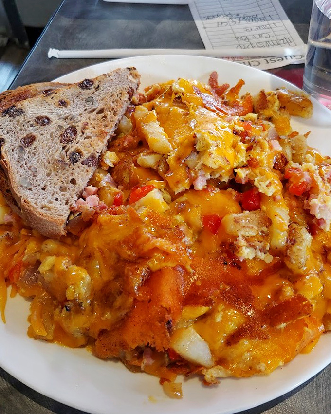 Cinnamon raisin toast playing sidekick to a scramble that's stealing the show. Cheese melting into potatoes like they were meant to be together.