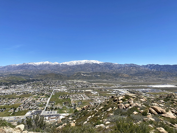 From mountain majesty to suburban sprawl, this vista captures California's perfect contradiction—wilderness and civilization in one spectacular frame.