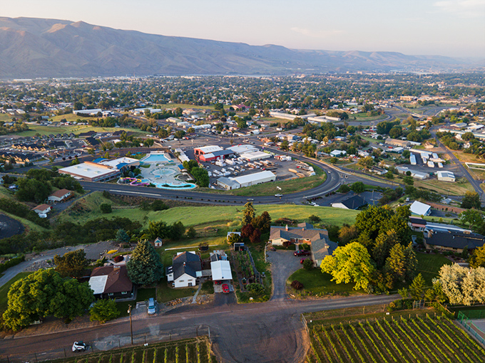 An aerial view reveals Clarkston's perfect positioning – nestled between rolling hills and waterways, with just enough development to provide conveniences without congestion.