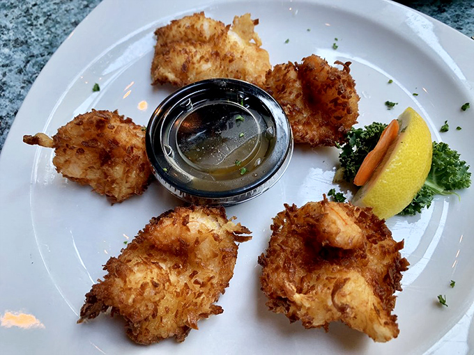 Coconut shrimp arranged like a delicious clock, counting down the minutes until you'll inevitably order another round.