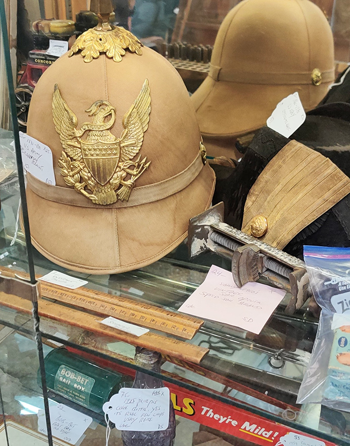 Military helmets and measuring tools share display space &ndash; the unexpected juxtapositions are what make antique hunting an adventure in historical context.