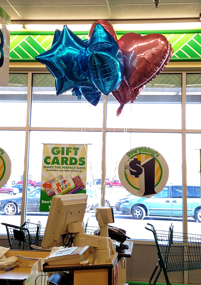 Festive balloons and gift cards near the checkout &ndash; the final temptation in a store designed to make you feel like a savvy shopping champion.